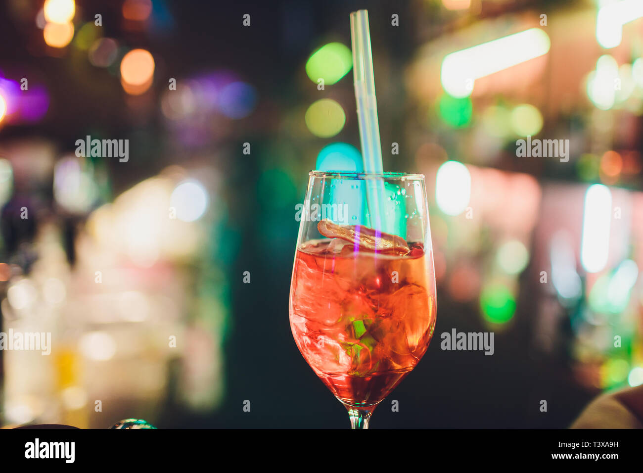 glasses of cocktails on the bar. bartender pours a glass of sparkling wine with Aperol Stock ...