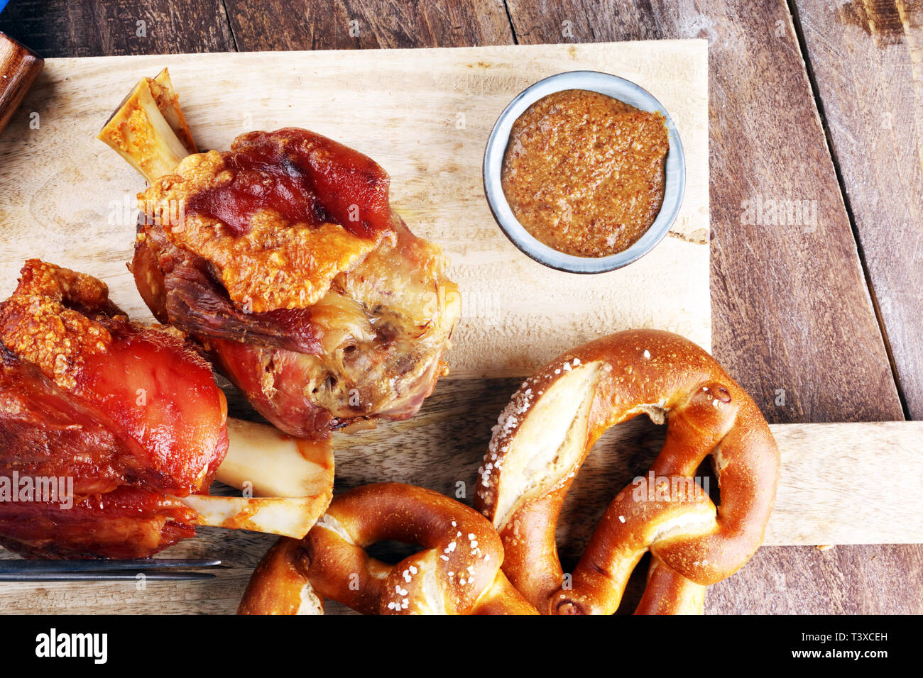 Traditional German cuisine, Schweinshaxe roasted ham hock. pretzels ...