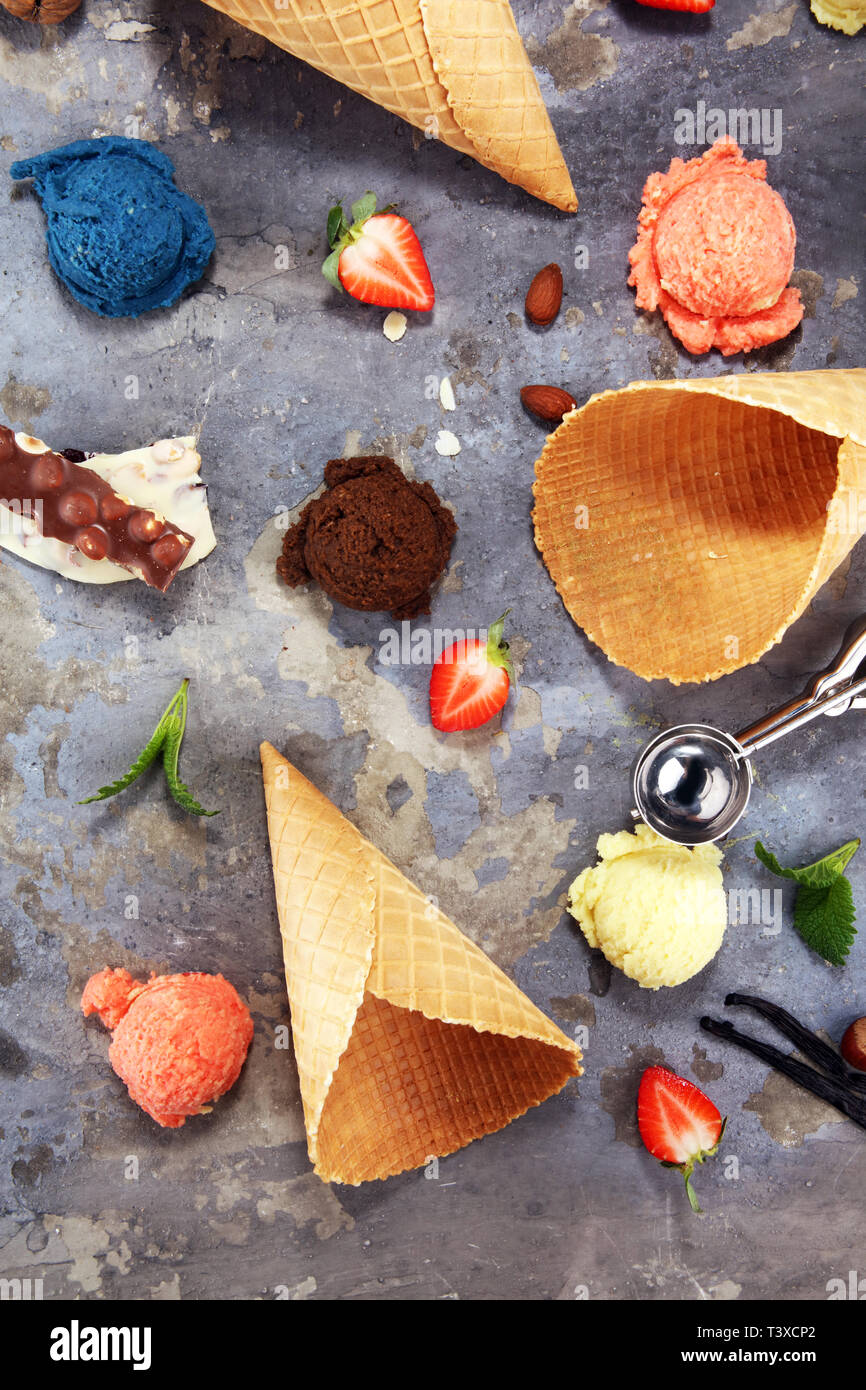 Set of ice cream scoops of different colors and flavours with berries ...