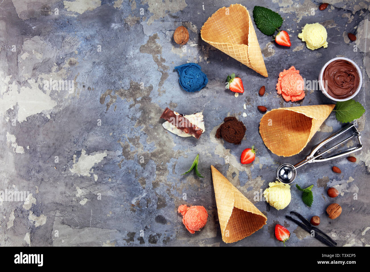 Set of ice cream scoops of different colors and flavours with berries ...