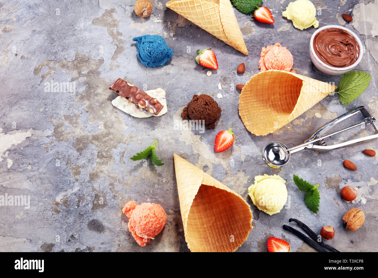 Set of ice cream scoops of different colors and flavours with berries ...