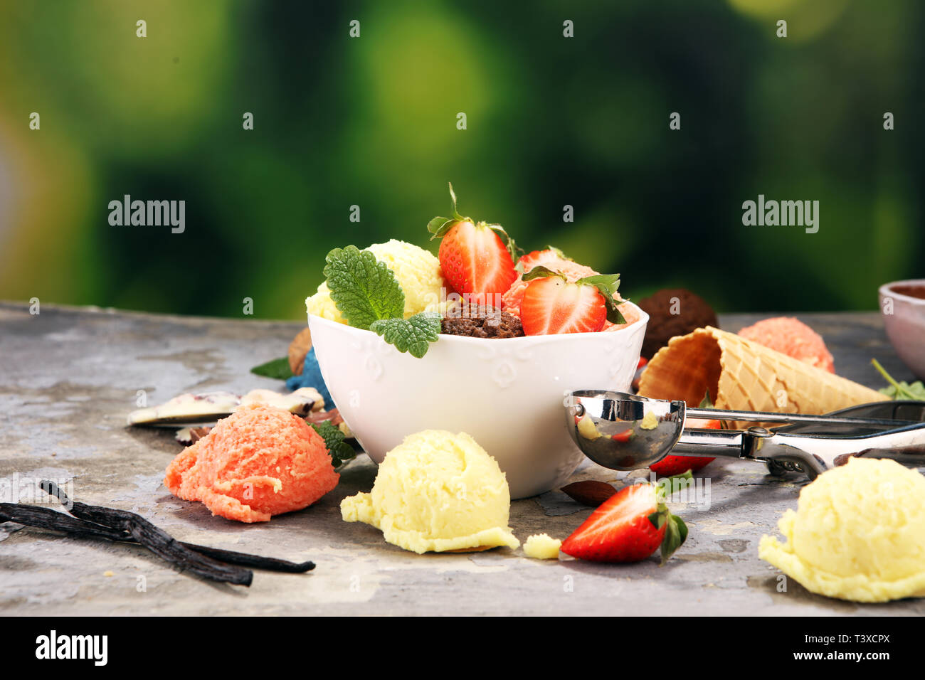 Set of ice cream scoops of different colors and flavours with berries ...