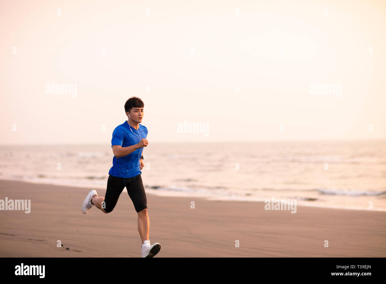 Young fit man jogging on hi-res stock photography and images - Alamy