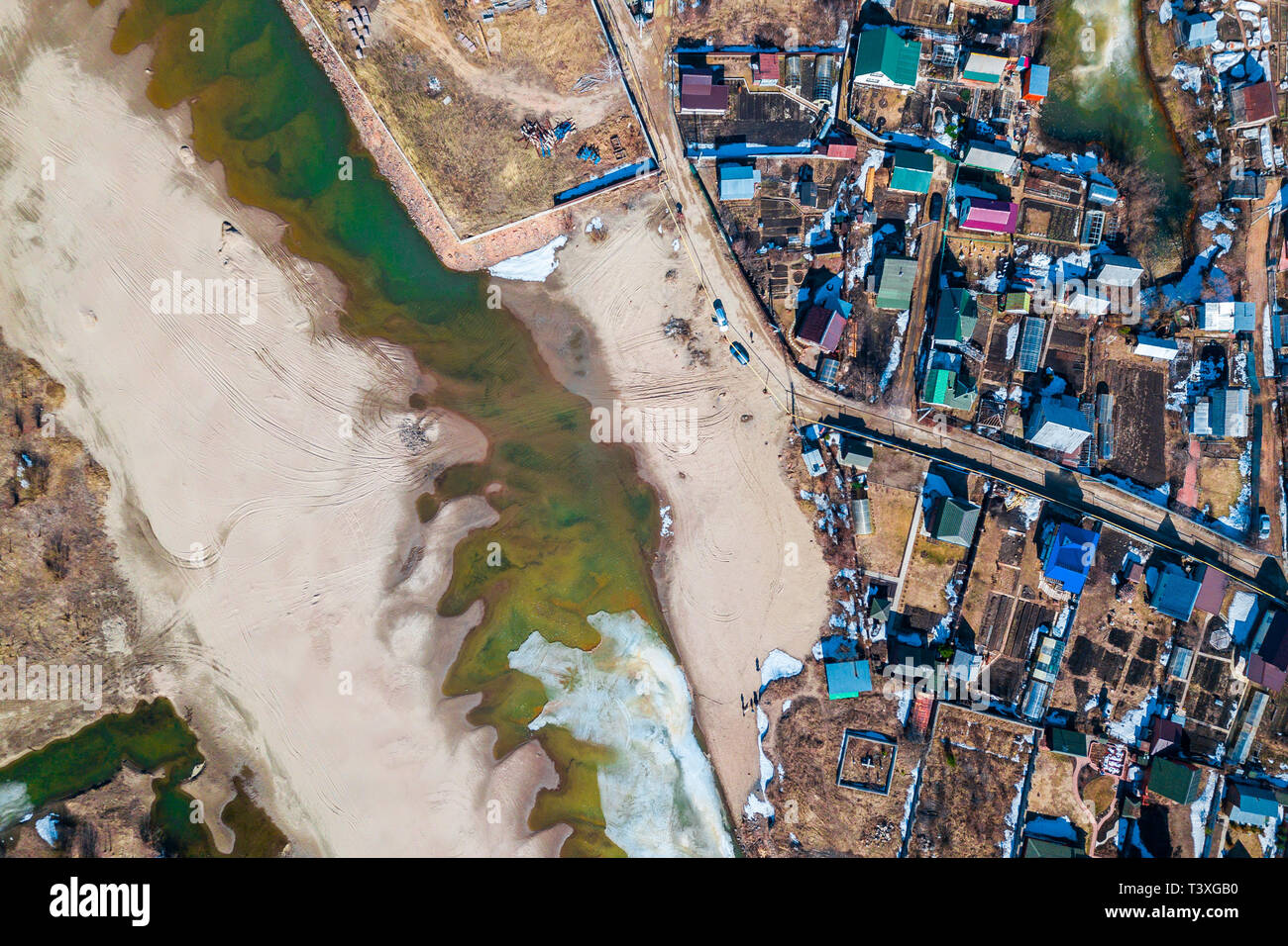 Aerial photography of a small village with villas and cottages, river ...