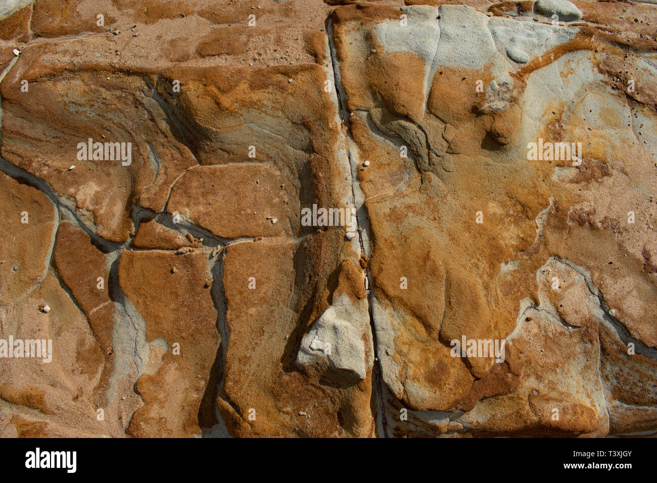 A limestone rock outcrop with different bands of rock, color and ...