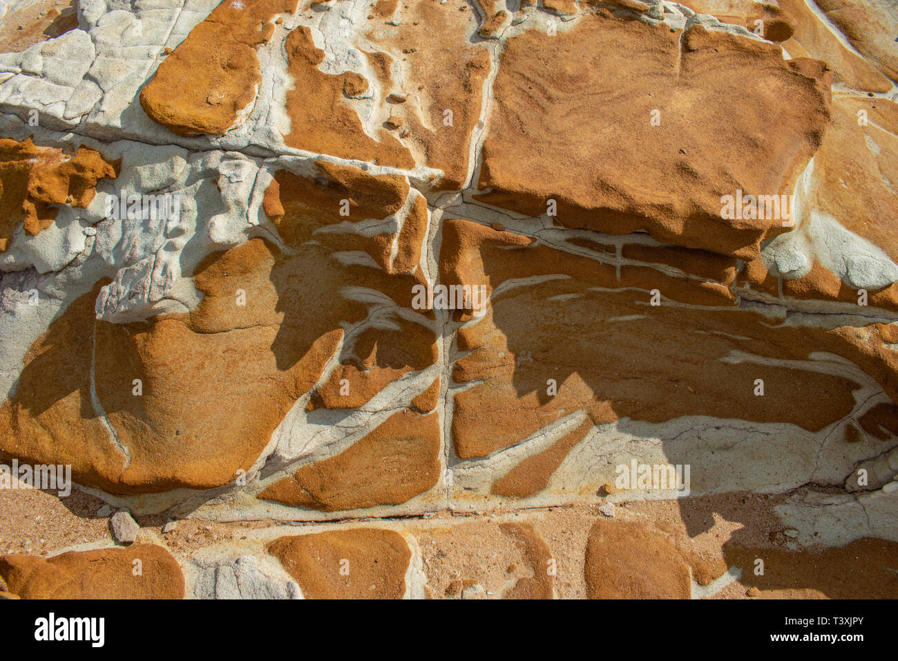 A limestone rock outcrop with different bands of rock, color and ...
