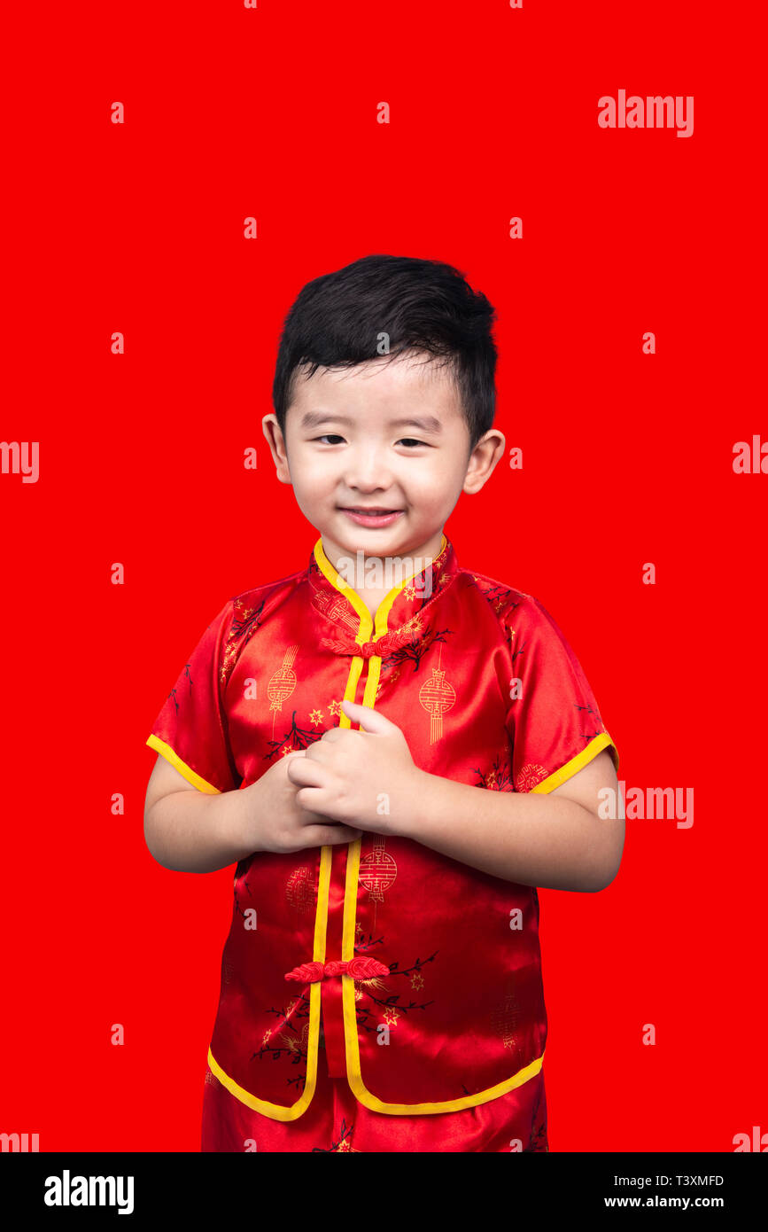Chinese New Year Concept, Cute Asian boy in red traditional Chinese ...
