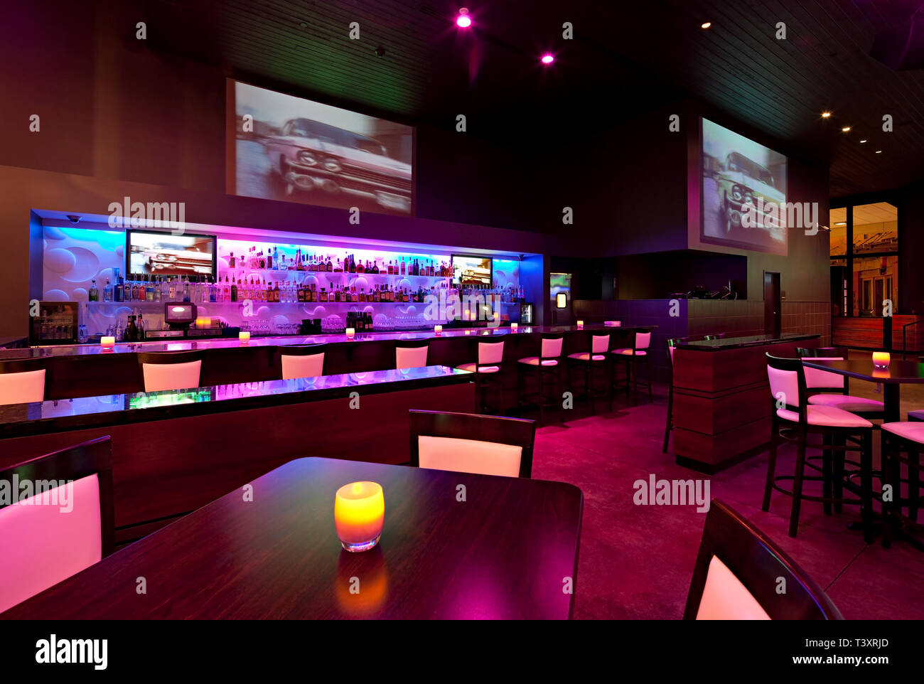 Empty nightclub illuminated with pink and purple light Stock Photo - Alamy