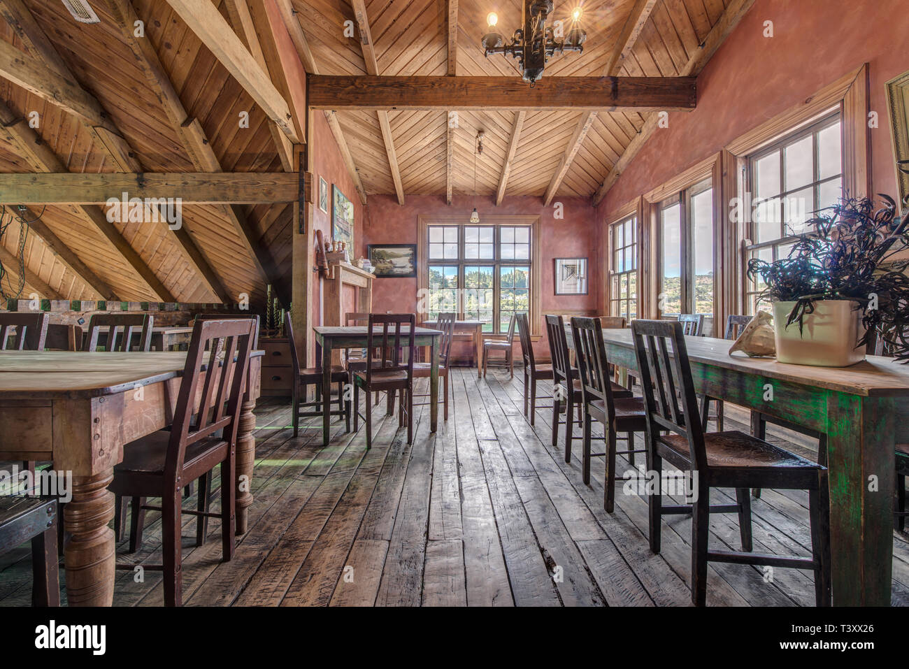Empty chairs and tables in restaurant Stock Photo - Alamy