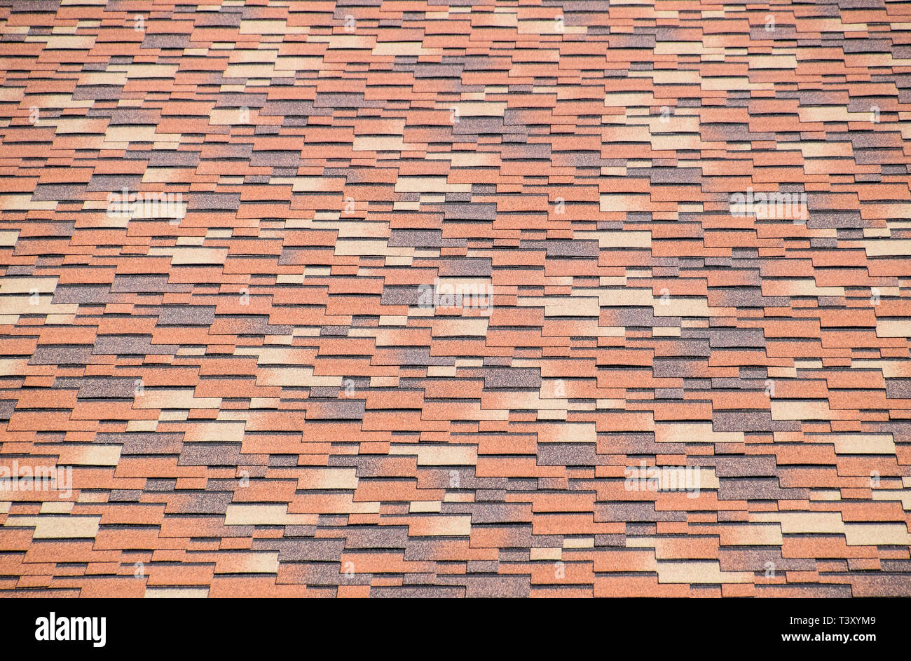 Roof from multi-colored bituminous shingles. Patterned bitumen shingles ...