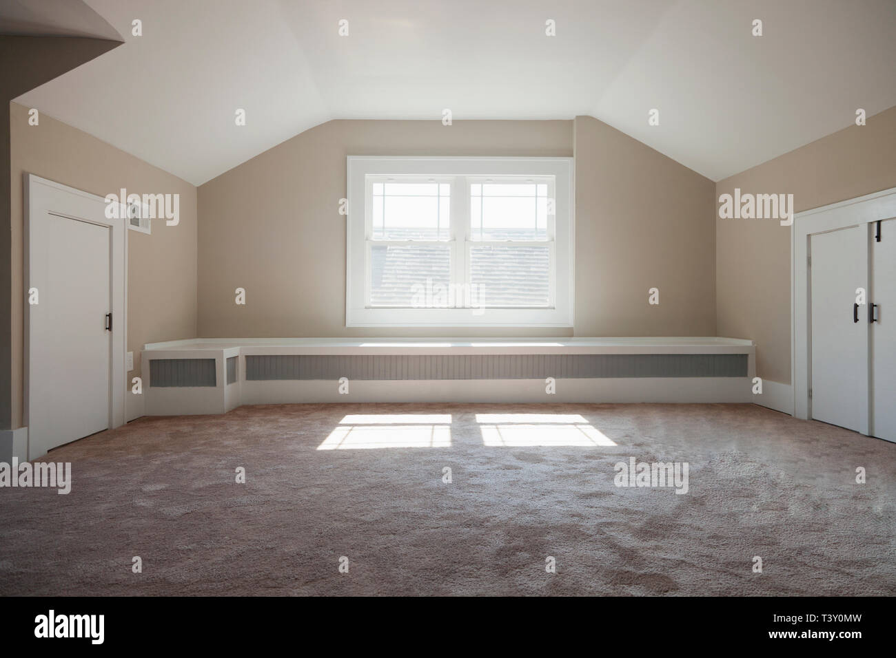 Window in empty attic room Stock Photo - Alamy