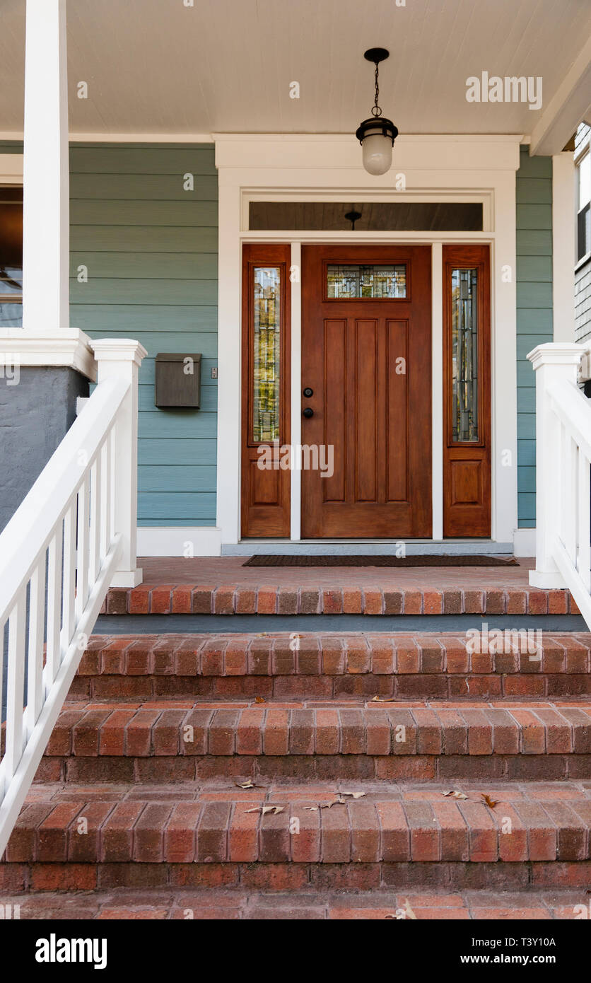 Brick steps and front door of house Stock Photo - Alamy