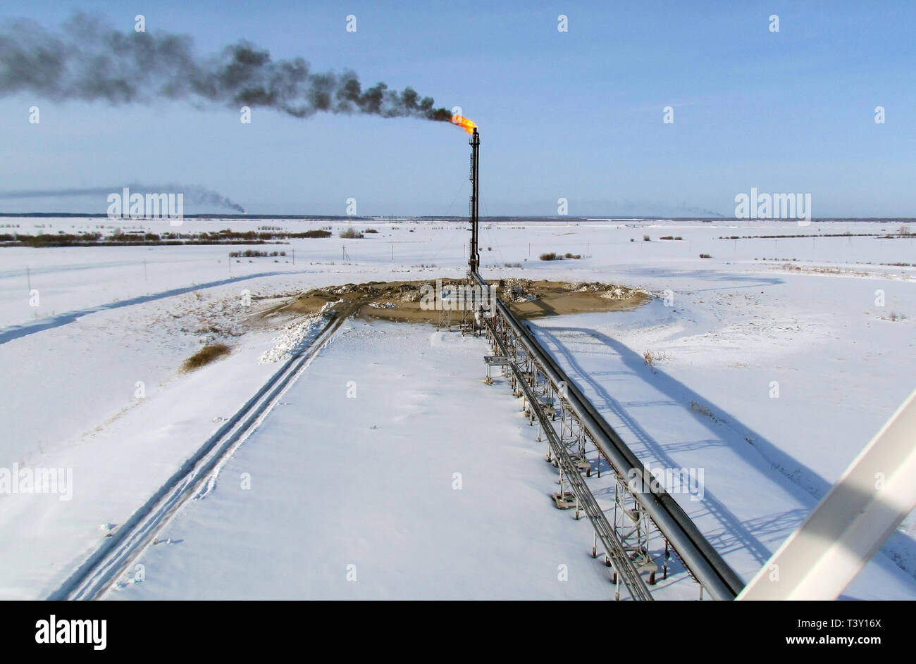 System of a torch on an oil field. Area flare system Stock Photo - Alamy