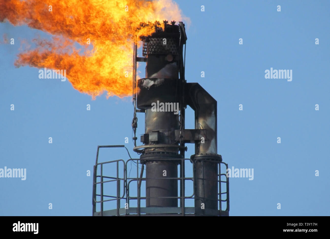 System of a torch on an oil field. Burning through a torch head Stock ...