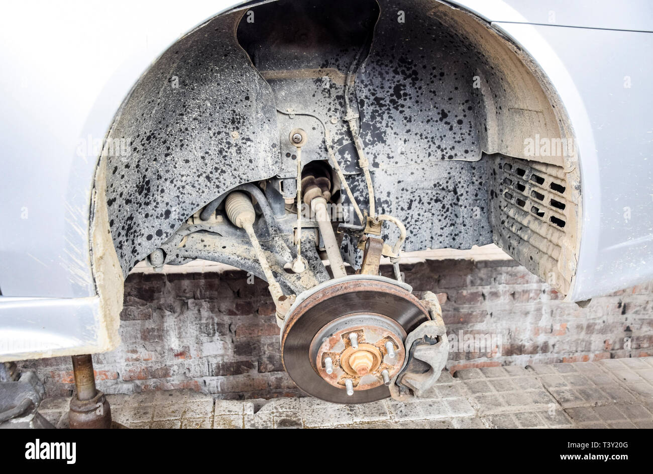 The car is a hundred for repairs. The wheel is removed. Replacement of ...