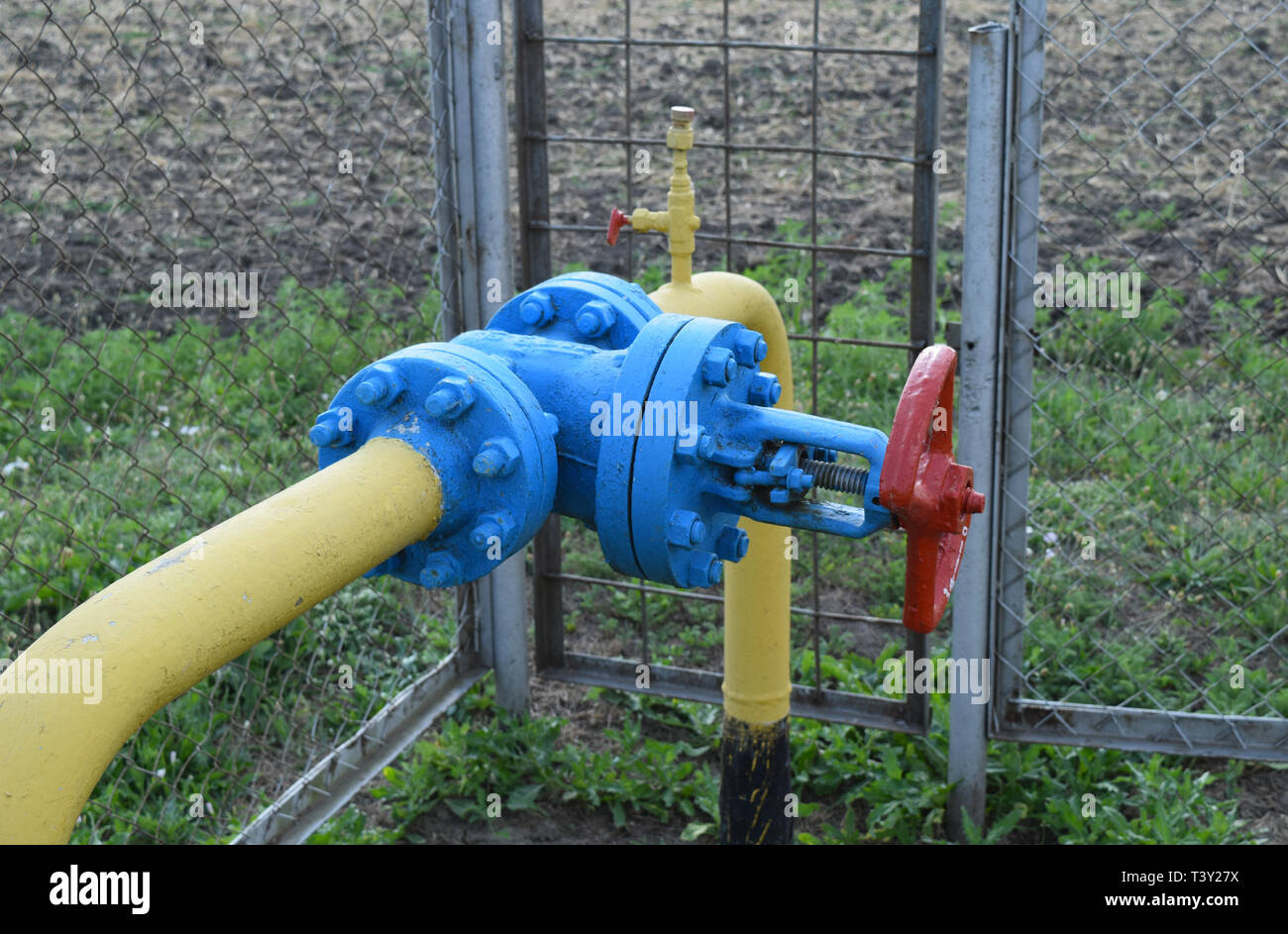 The latch on the underground gas pipeline protected with a fence Stock ...