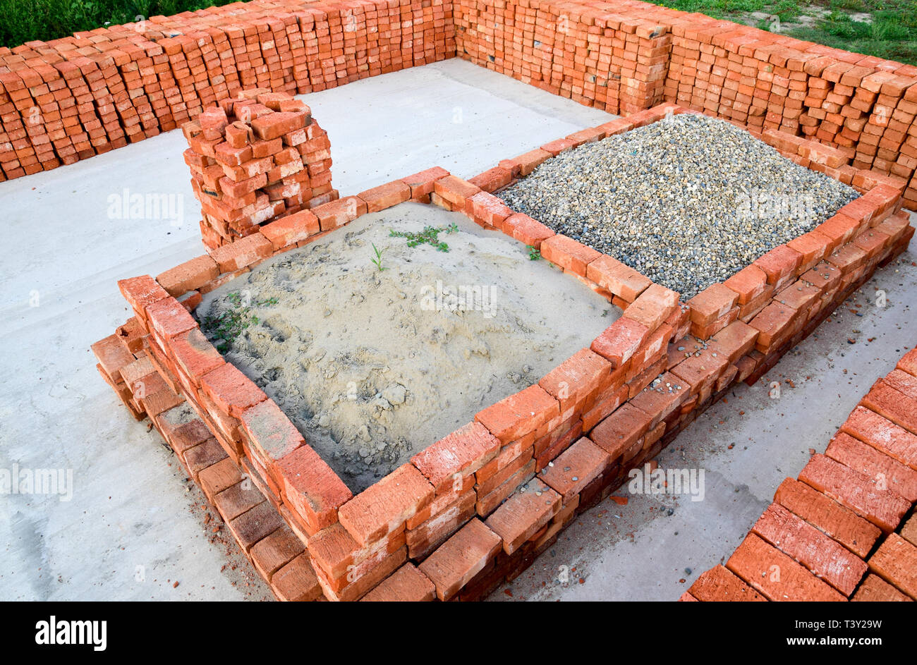 The red brick folded neatly on the foundation of the house. Home ...