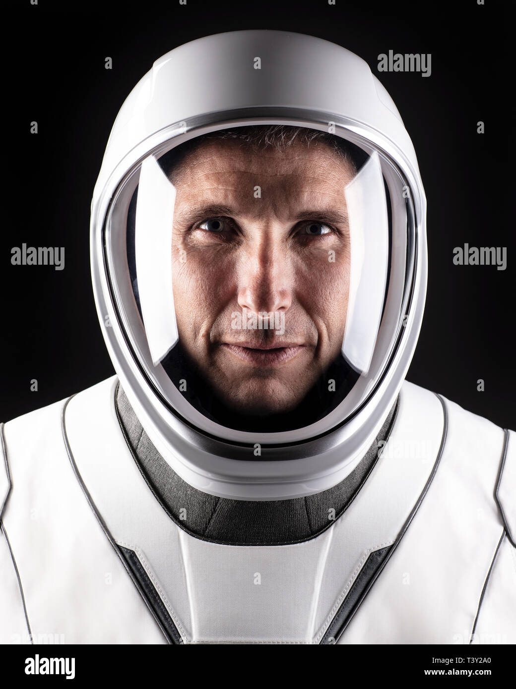 SpaceX astronaut Mike Hopkins poses in the new SpaceX Crew Flight Test ...