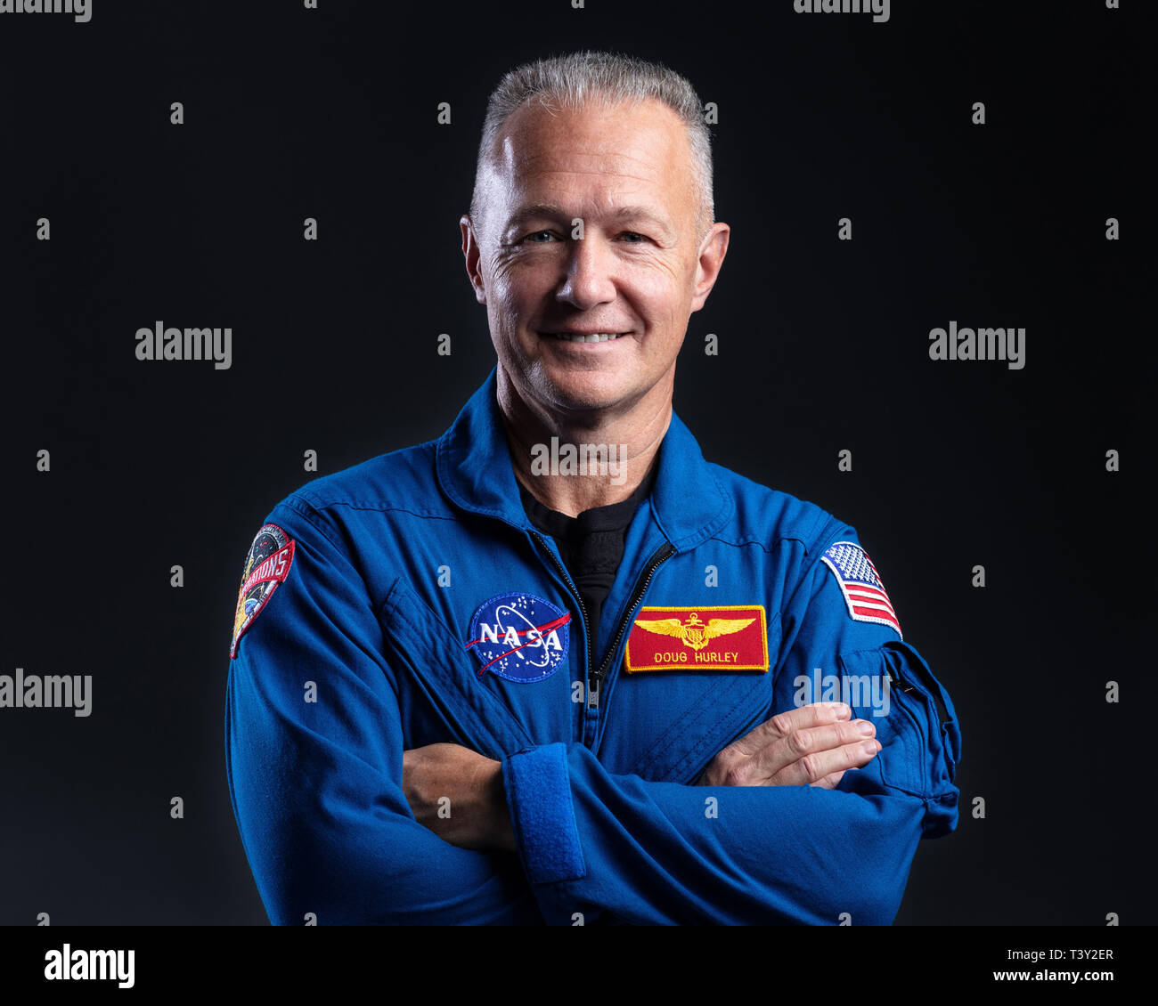 SpaceX astronaut Doug Hurley poses in a blue NASA flight suit November ...