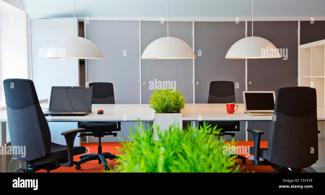 Modern workstation area in office Stock Photo - Alamy