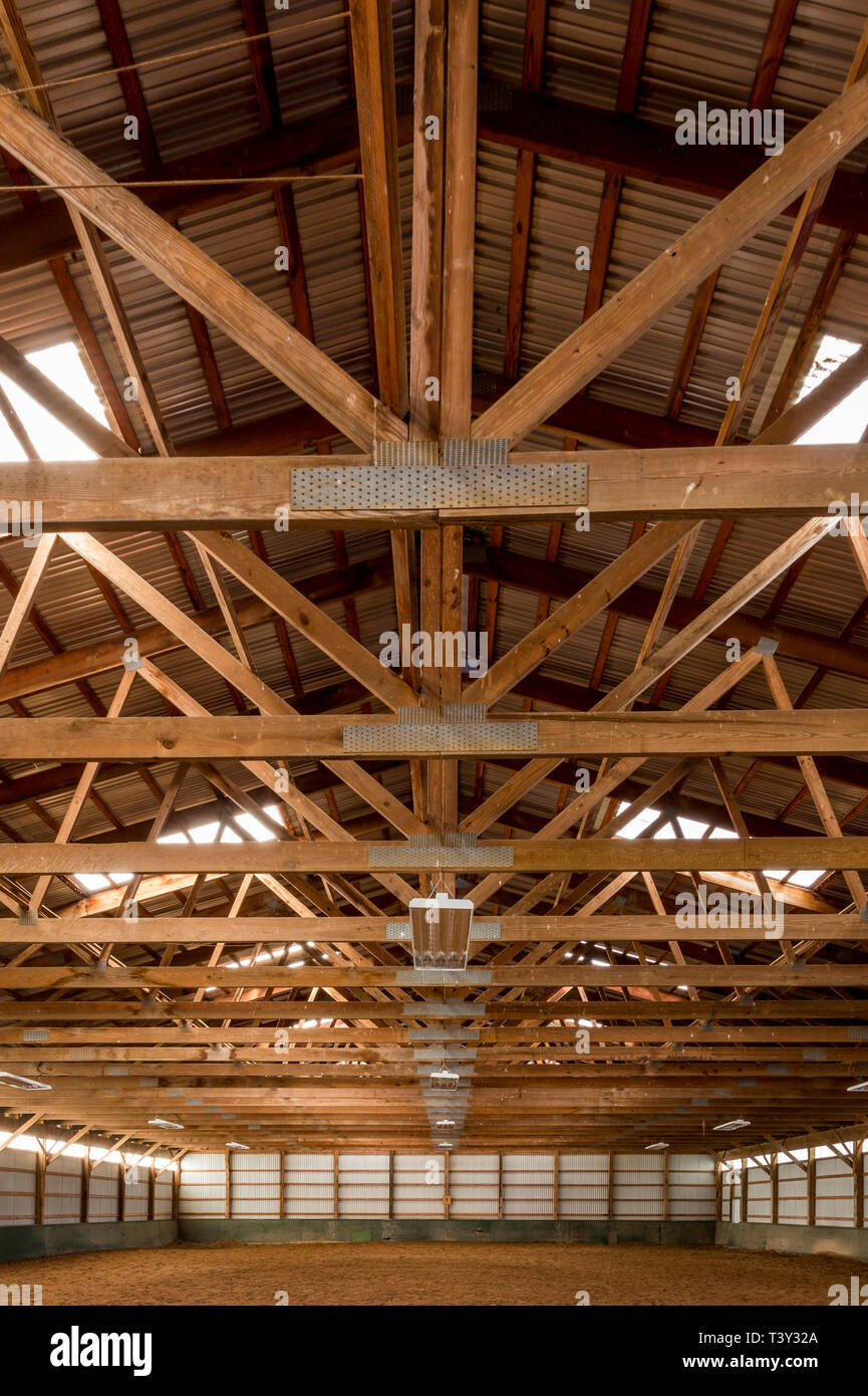 Wooden rafters in indoor horse riding ring Stock Photo - Alamy