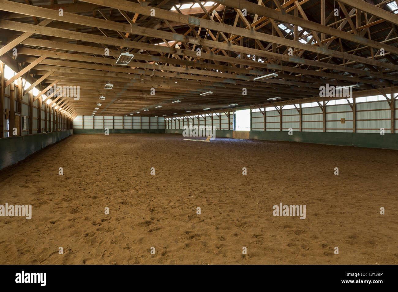 Empty indoor horse riding ring Stock Photo - Alamy