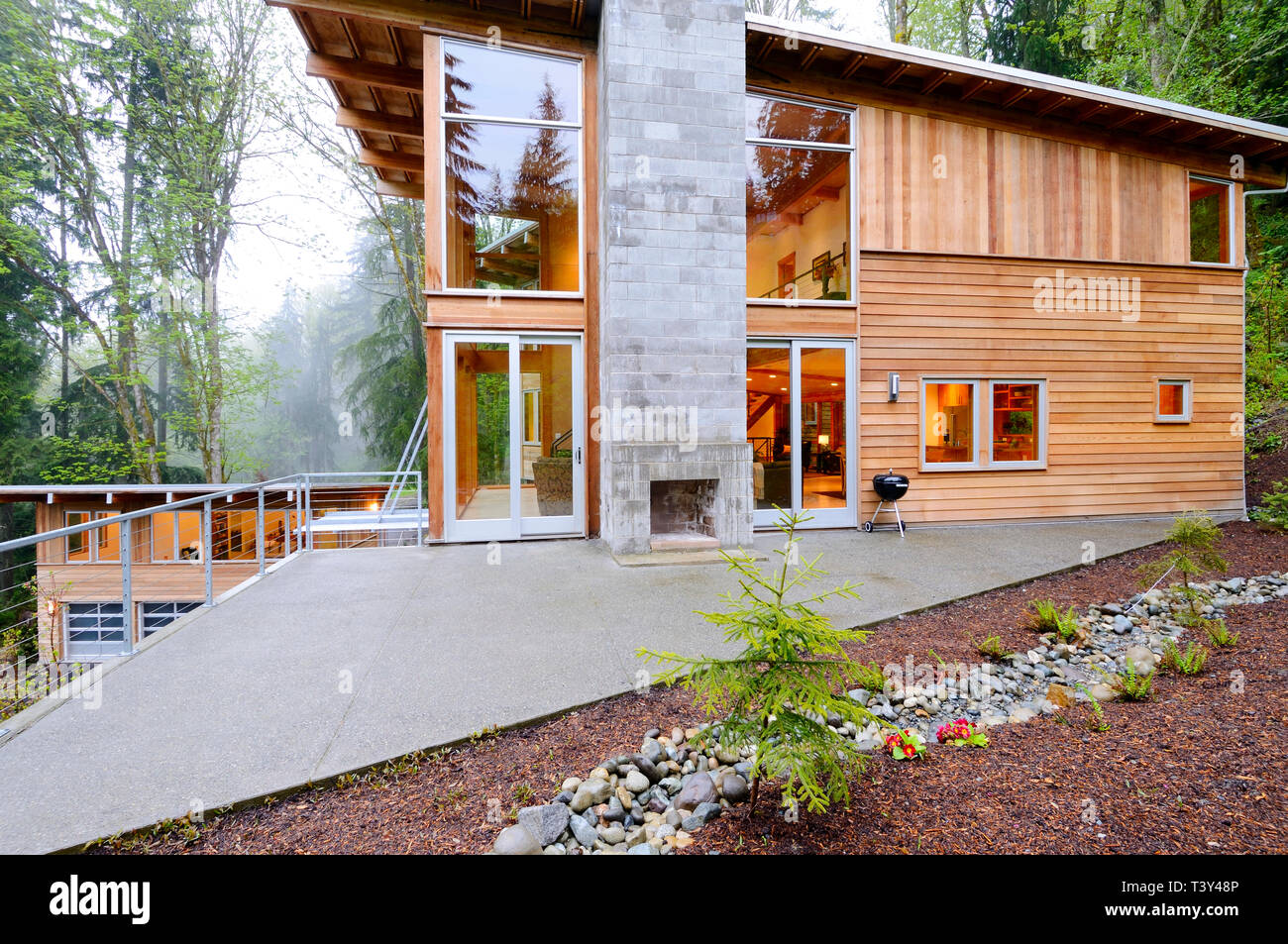 Outdoor fireplace of modern house Stock Photo - Alamy