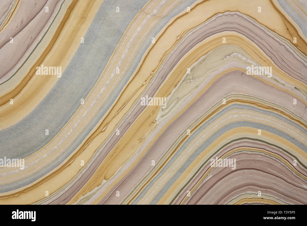 background of handmade Thai marbled mulberry paper with flowing pattern ...