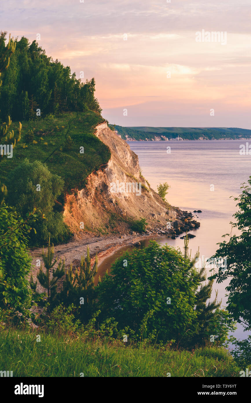 Sunrise light on the cliff with pine wood Stock Photo - Alamy