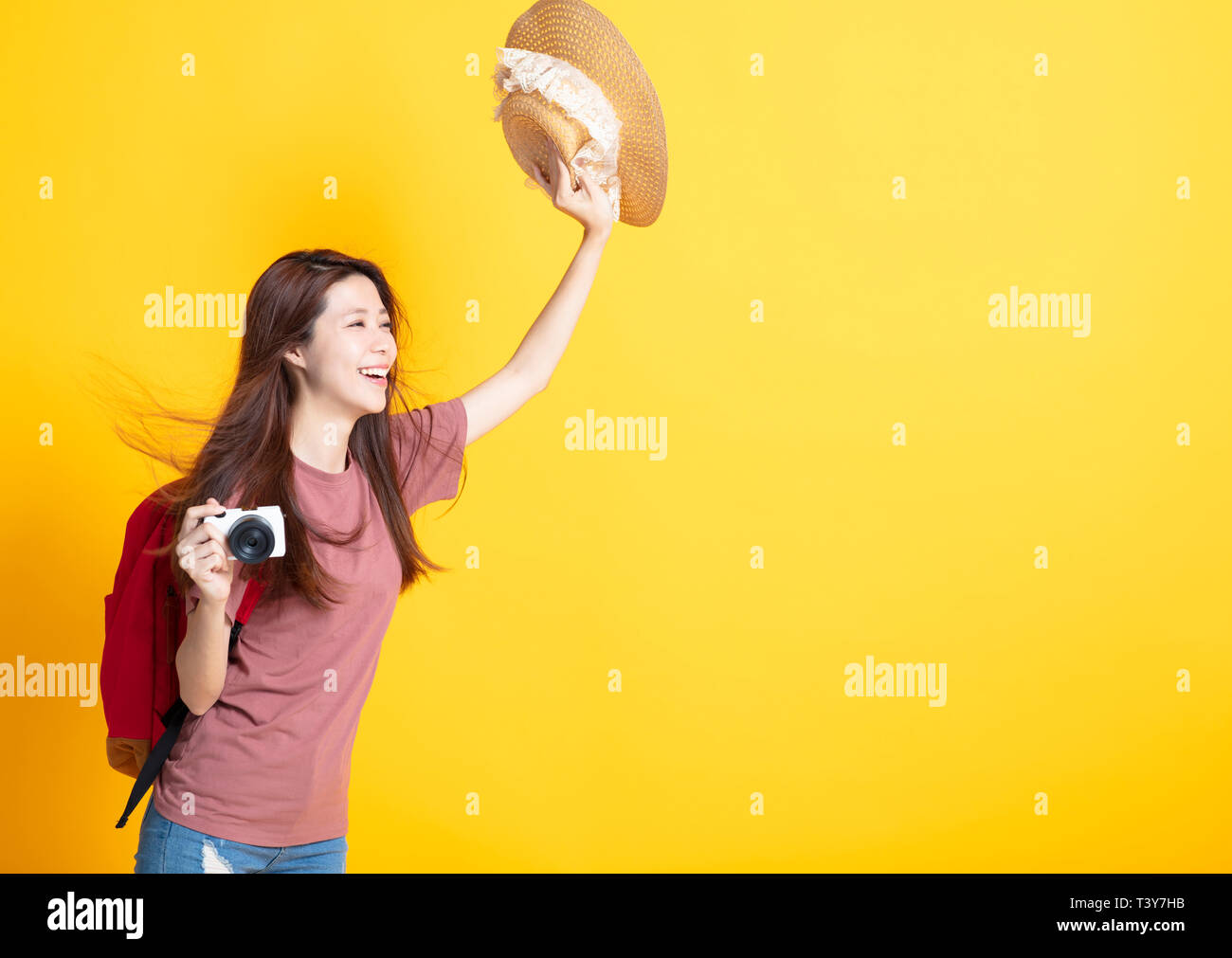 Woman holding her hat High Resolution Stock Photography and Images - Alamy