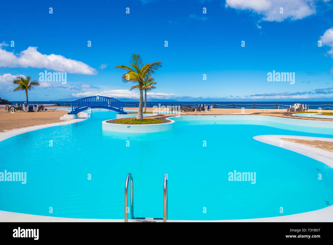 Swimming pools at blue sky Stock Photo - Alamy