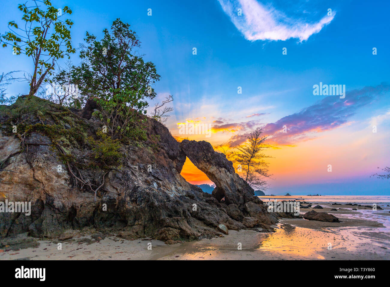 beautiful sunset in the hole of unusual rock wave eroded into the ...