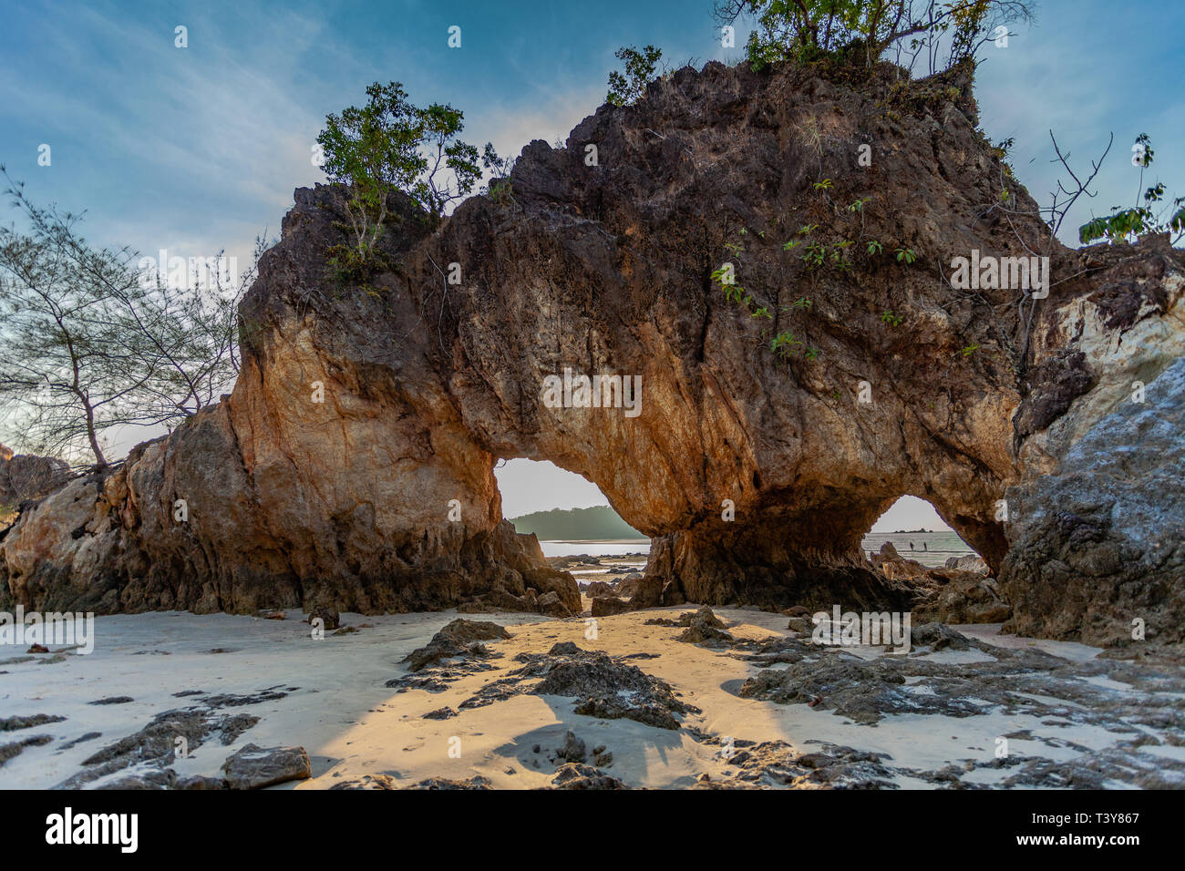 beautiful sunset in the hole of unusual rock wave eroded into the ...