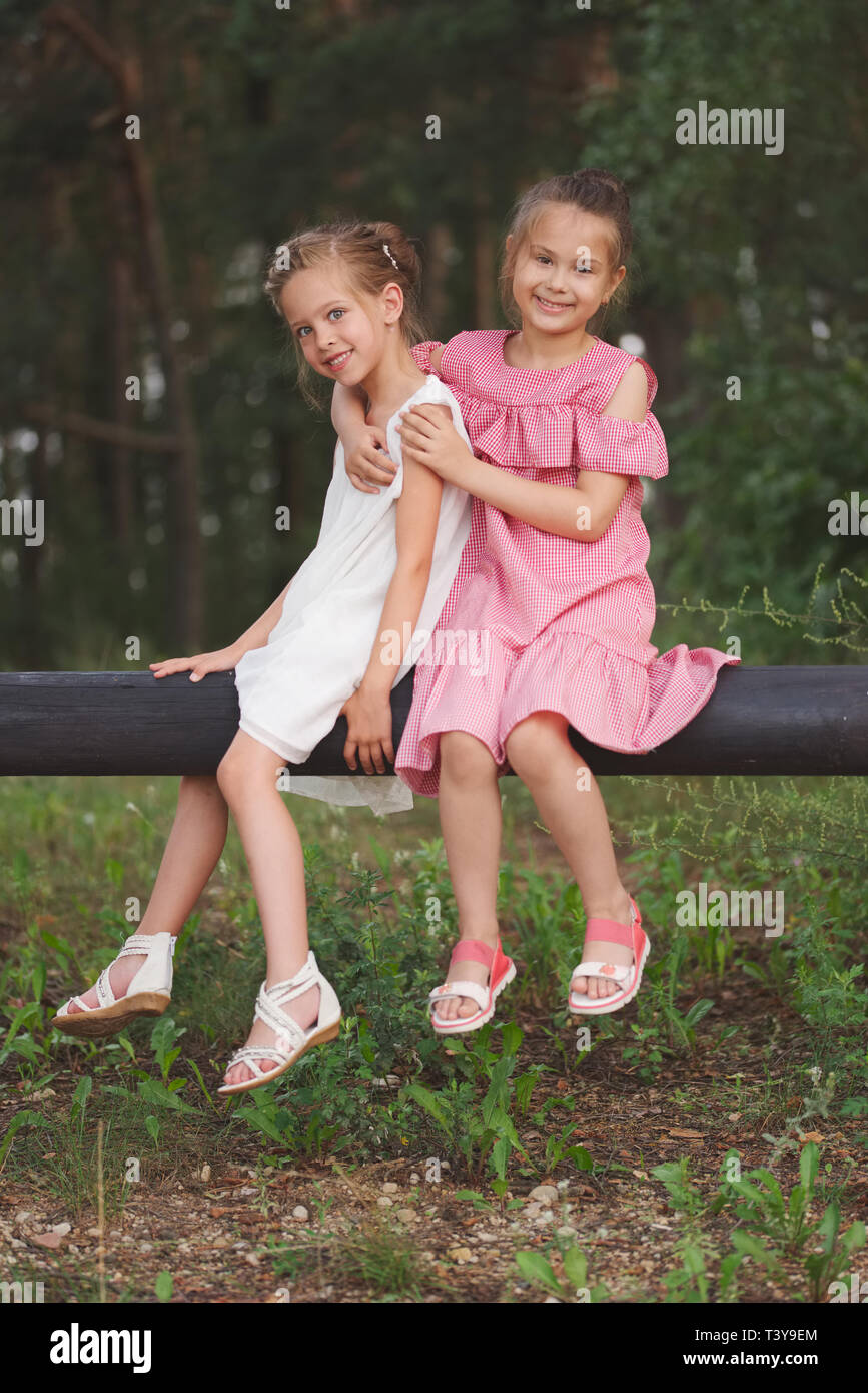 two best friends playing in summer park Stock Photo - Alamy