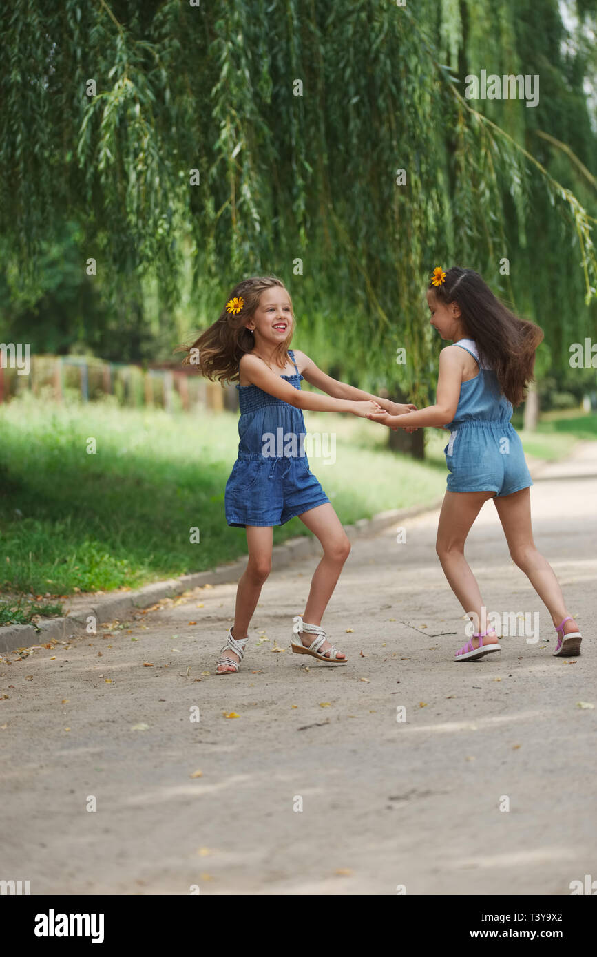 Photo Of Two Little Girls In Summer Park Stock Photo Alamy