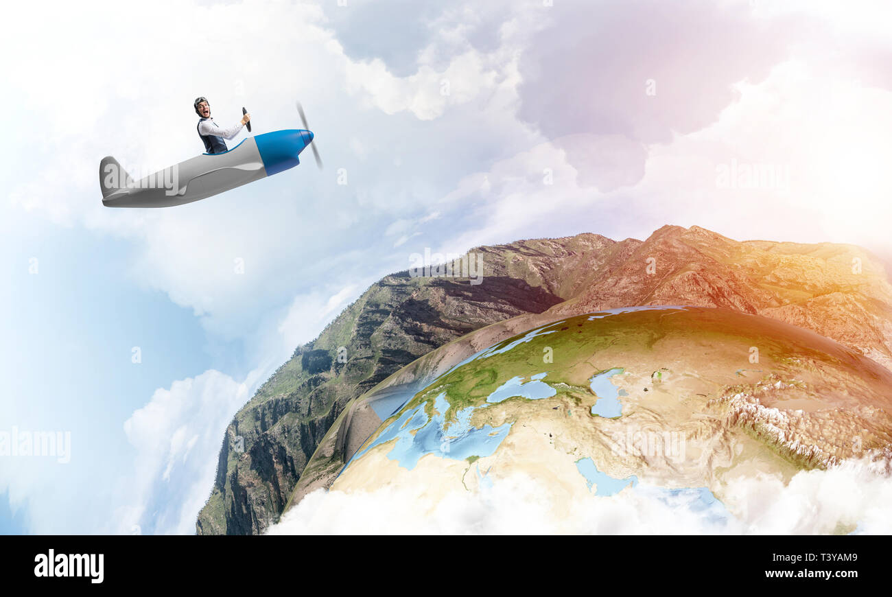 Happy pilot driving small propeller plane Stock Photo - Alamy