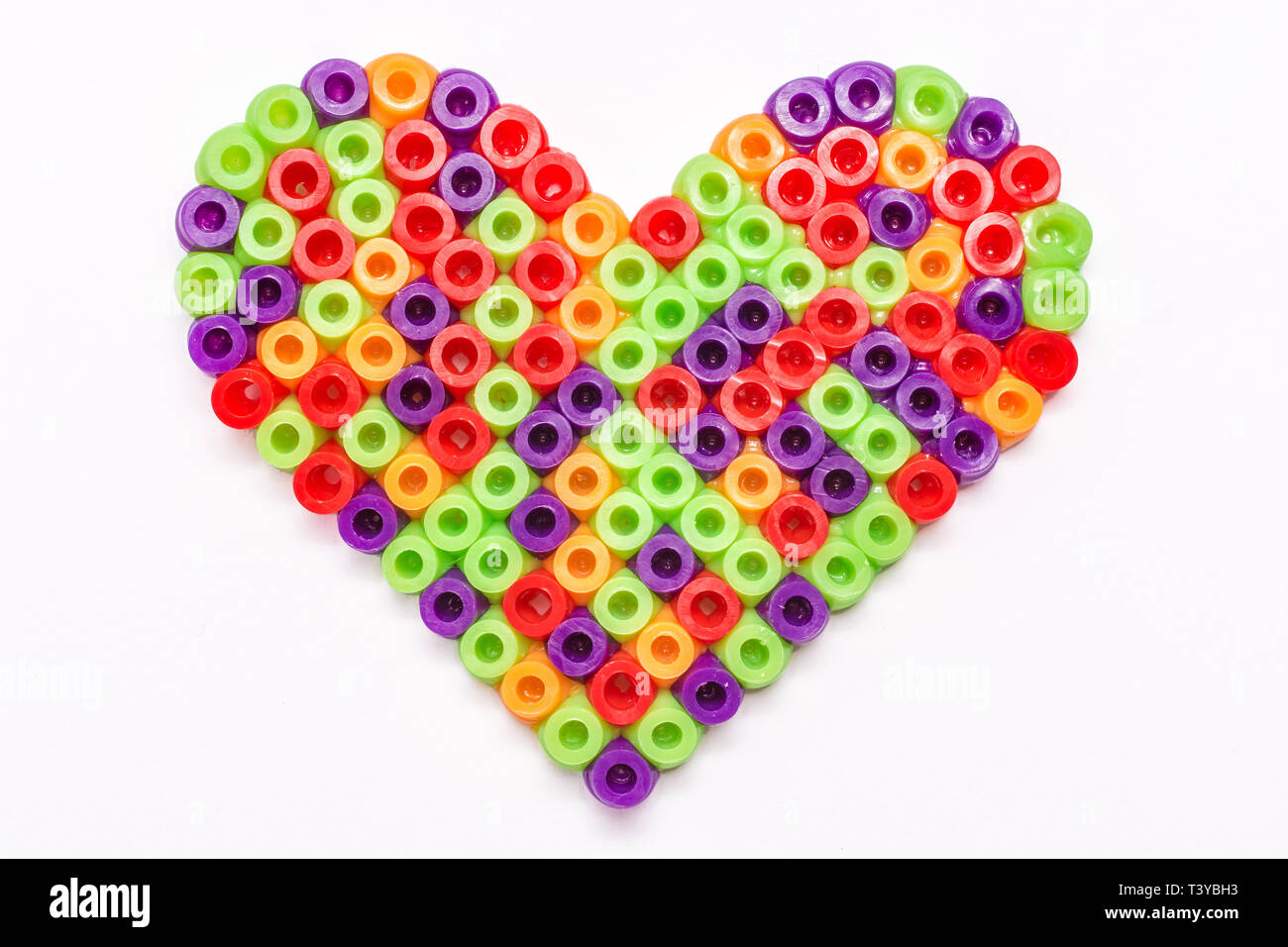 Handmade heart of plastic beads as a background Stock Photo - Alamy
