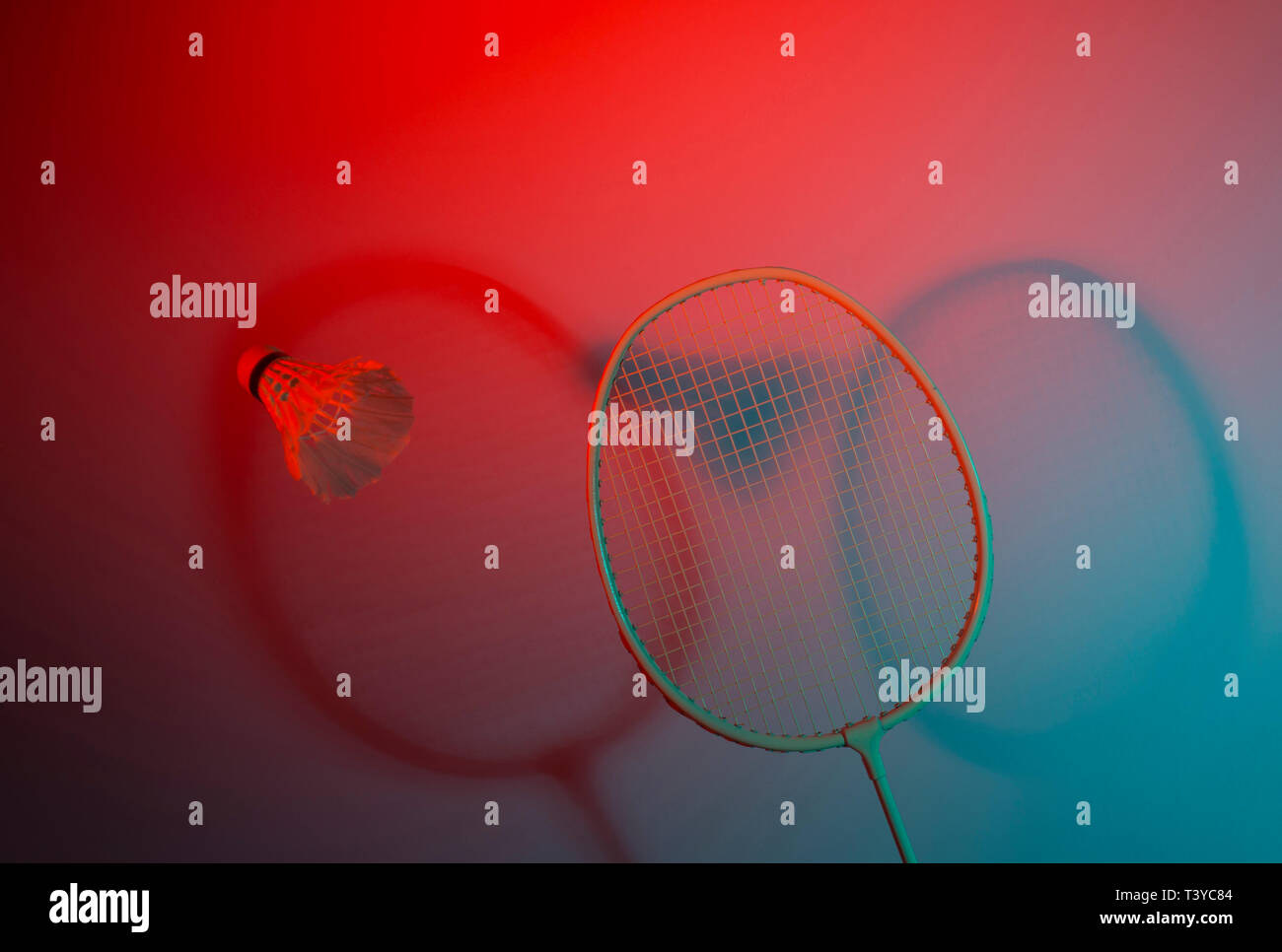 Close up shuttlecock and badminton racket on red background Stock Photo ...