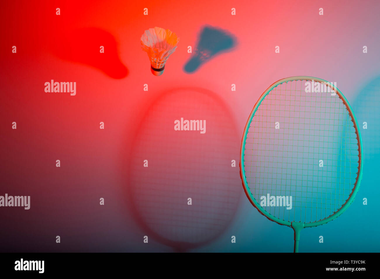 Close up shuttlecock and badminton racket on red background Stock Photo ...