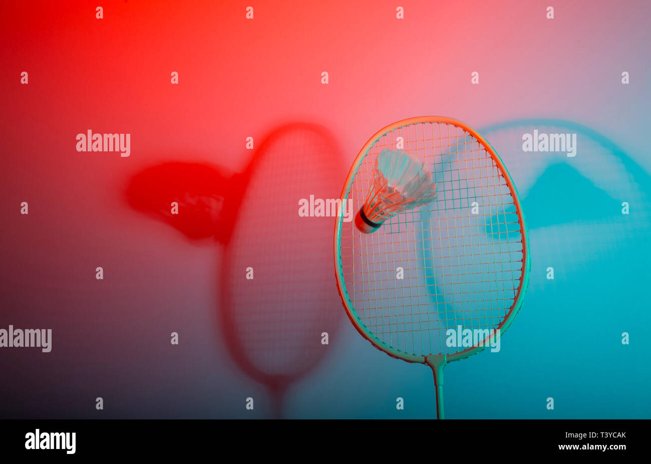 Close up shuttlecock and badminton racket on red background Stock Photo ...
