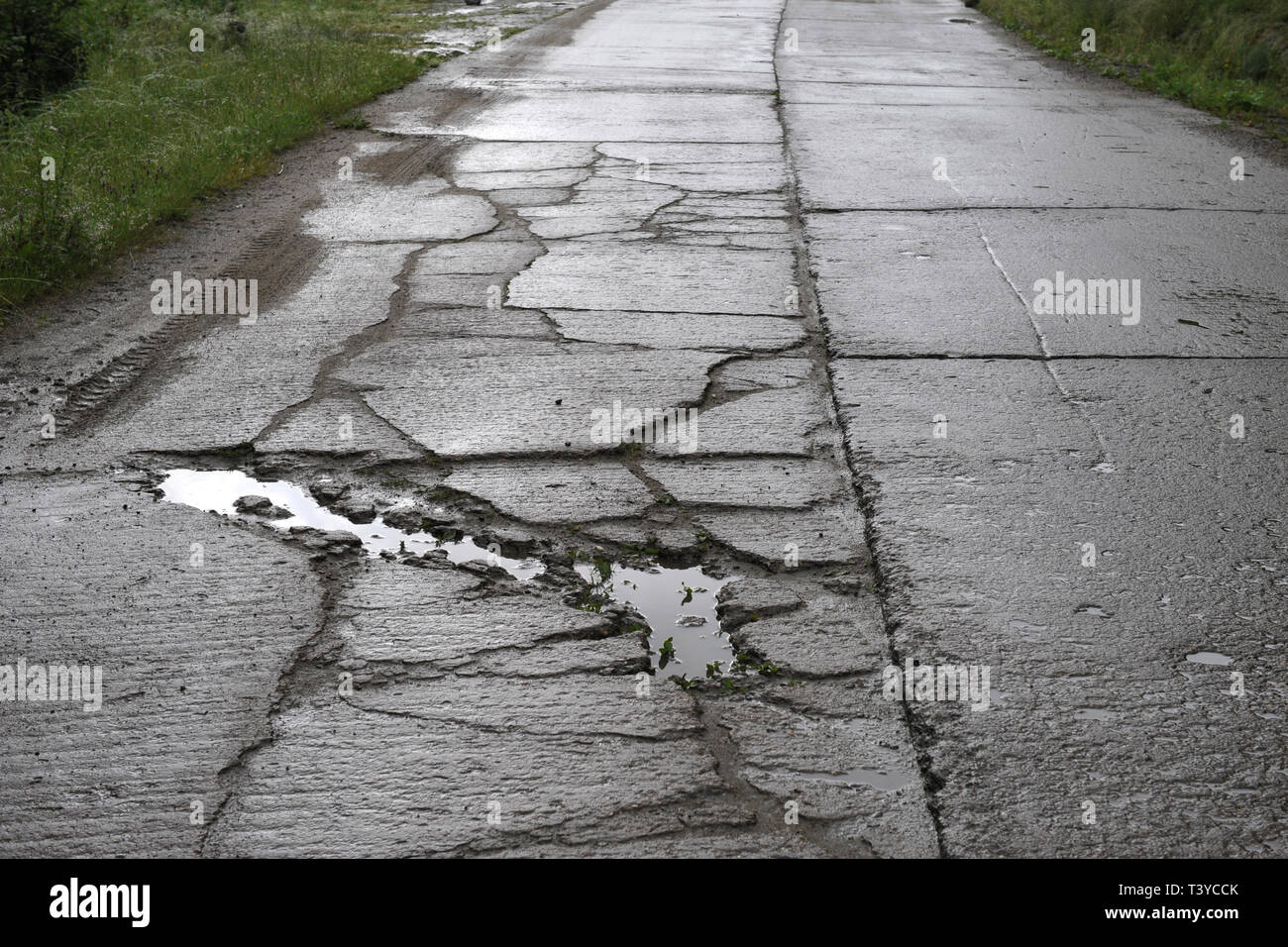 Damaged road in bad condition, Romania, Banat Stock Photo - Alamy