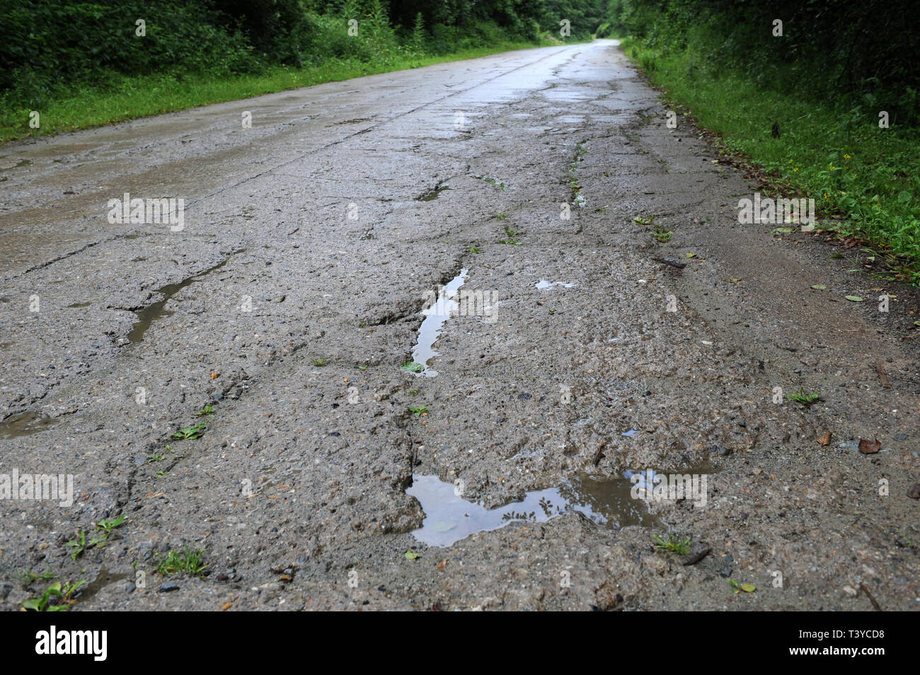 Damaged road in bad condition, Romania, Banat Stock Photo - Alamy