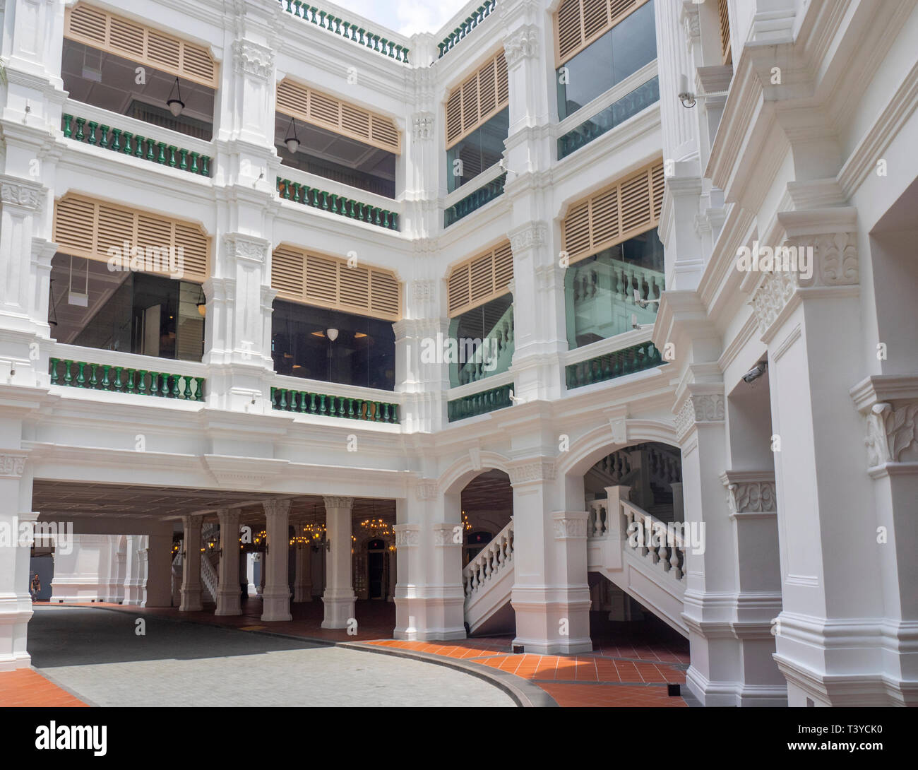 Courtyard and staircase of colonial architecture of Raffles Hotel Bras ...