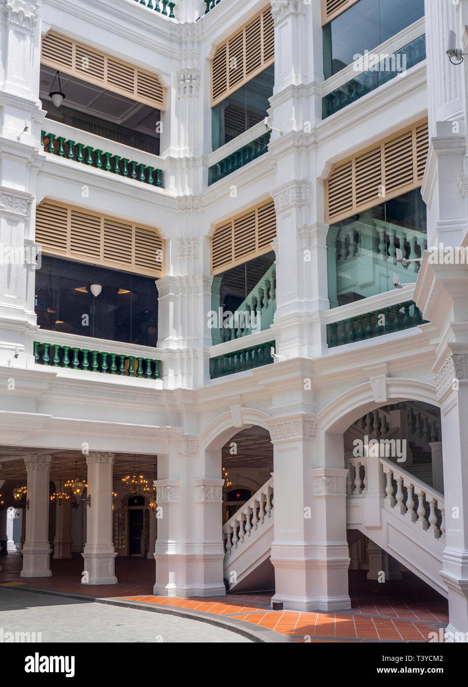 Courtyard and staircase of colonial architecture of Raffles Hotel Bras ...