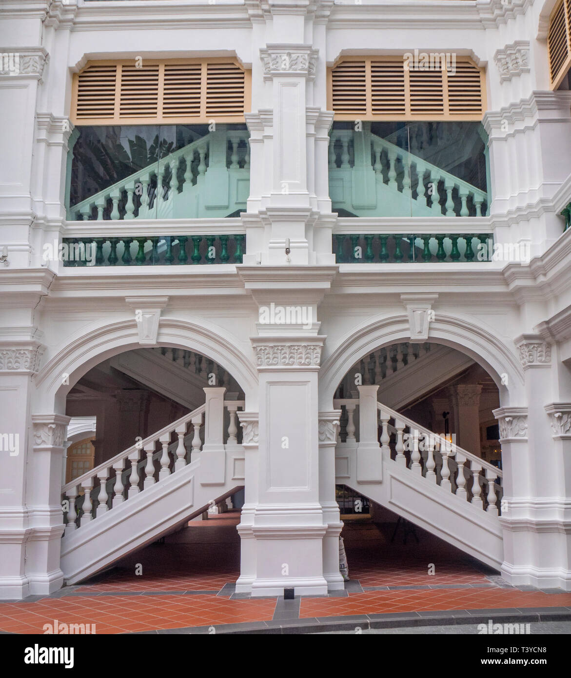 Courtyard and staircase of colonial architecture of Raffles Hotel Bras ...