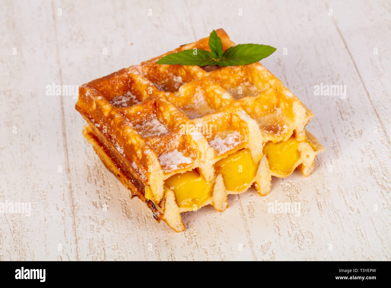 Sweet Waffle with berry jam Stock Photo - Alamy