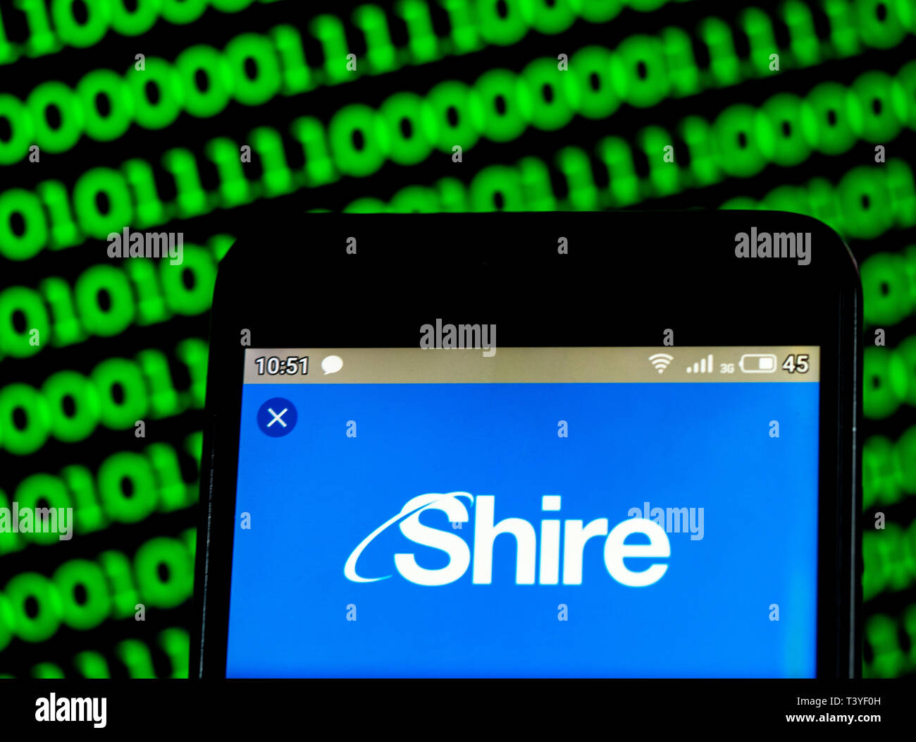 In this photo illustration a Shire Plc logo seen displayed on a smart ...