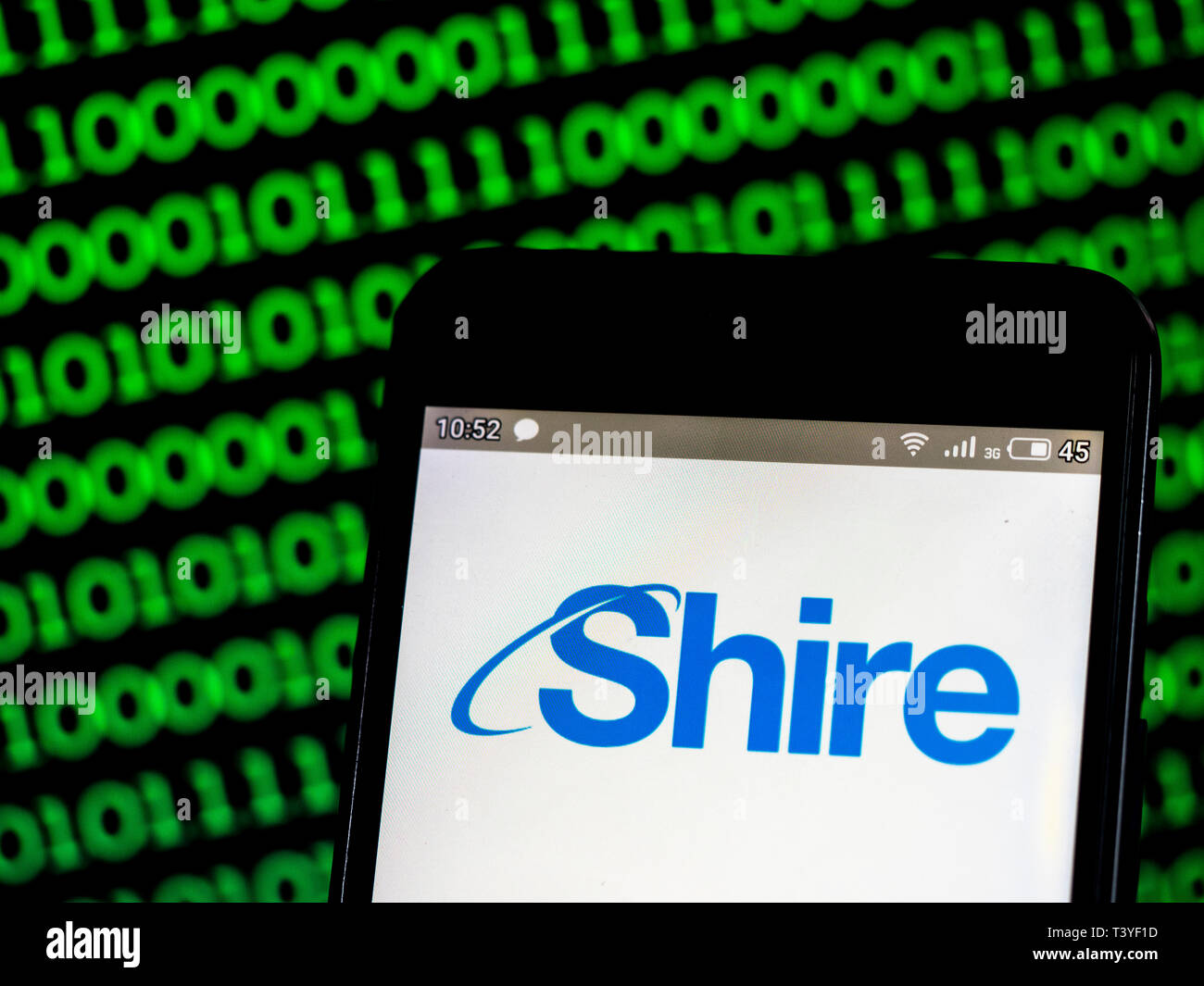 In this photo illustration a Shire Plc logo seen displayed on a smart ...