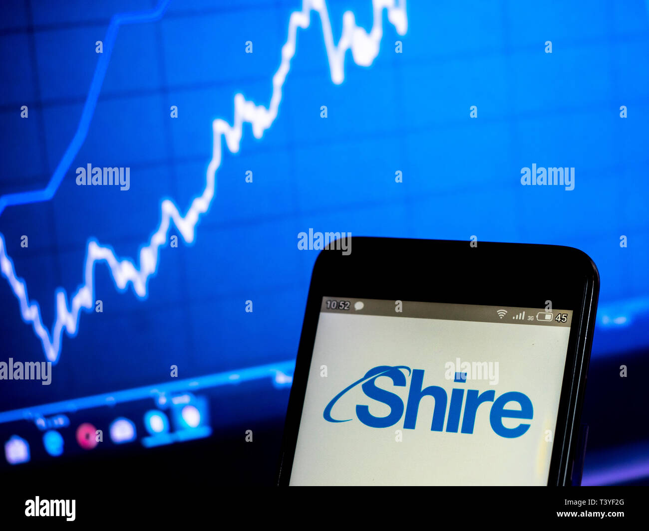 In this photo illustration a Shire Plc logo seen displayed on a smart ...