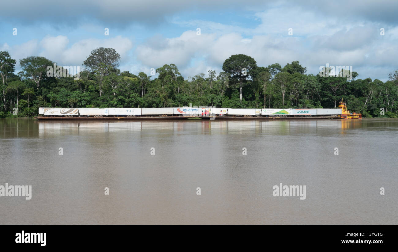 Amazon tugboat, pushing trucks and containers Stock Photo - Alamy